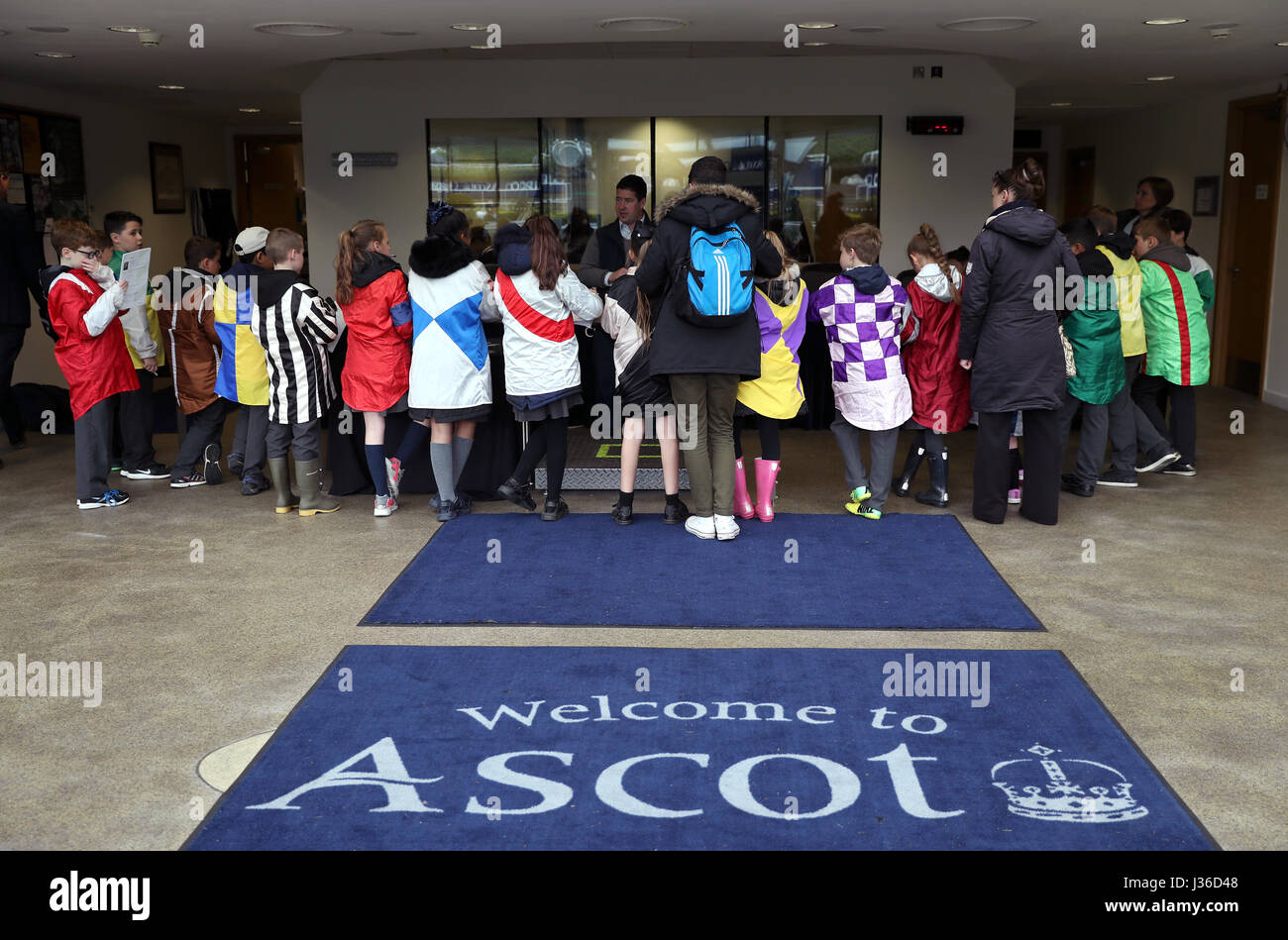 School children dressed in jockey silks are given a tour of Ascot ...