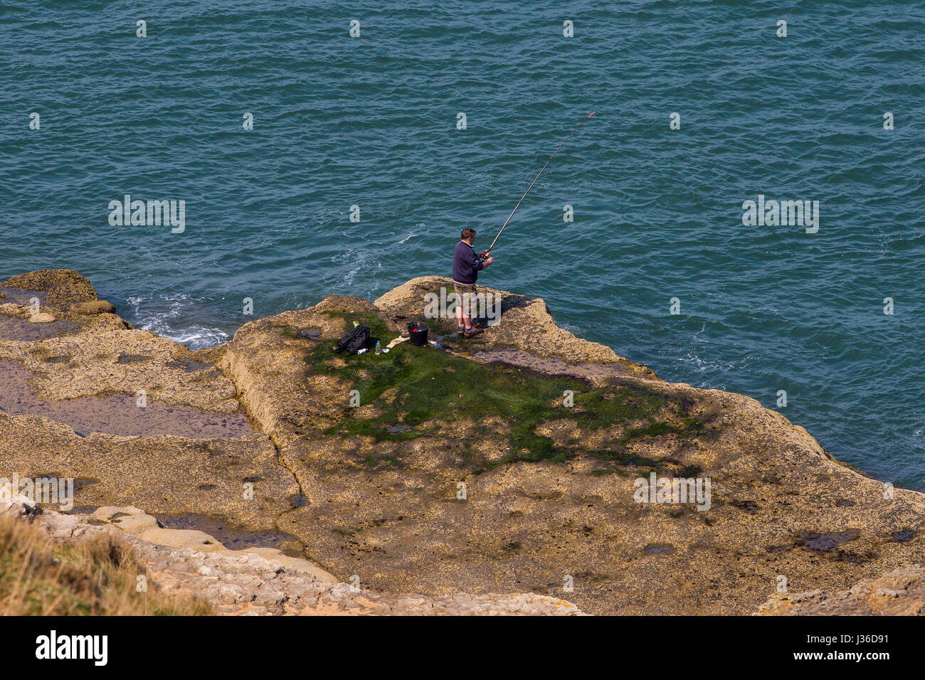 Man using fishing rod hi-res stock photography and images - Alamy