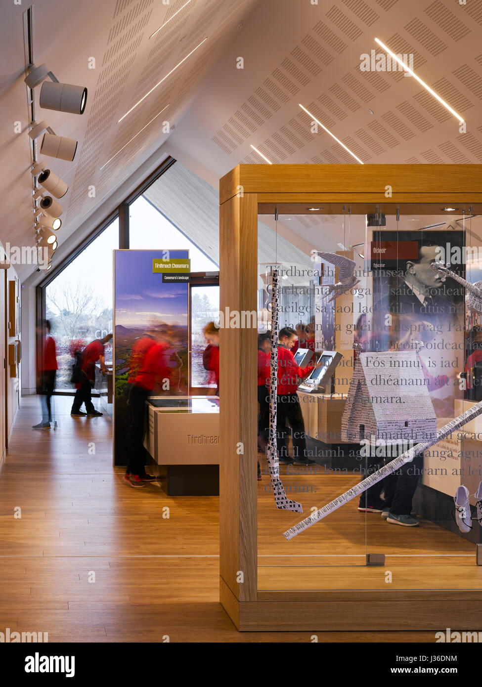 Interior view of exhibition space showing install and school group ...
