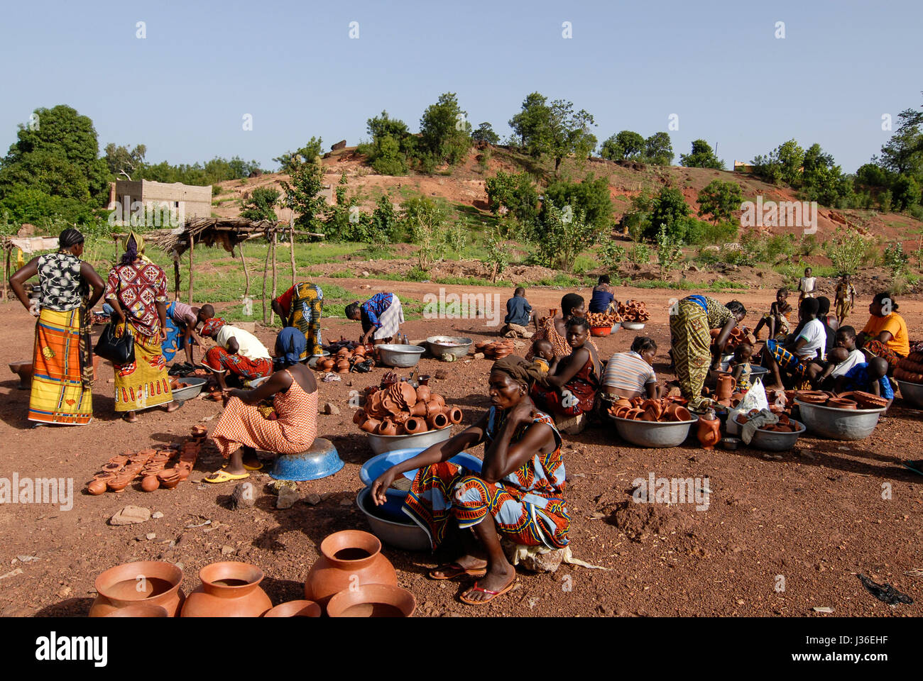 BURKINA Faso, Gaoua, women sell pottery at market / BURKINA FASO, Gaoua ...