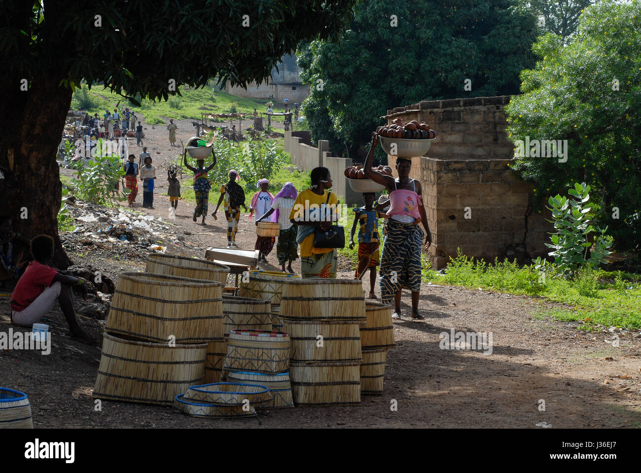 BURKINA Faso, Gaoua, women go to the market / BURKINA FASO, Gaoua ...
