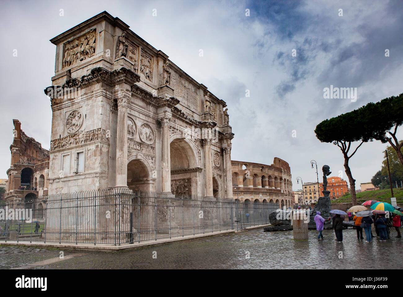 tourist looking to colosseum in rome italy in raining day Stock Photo ...