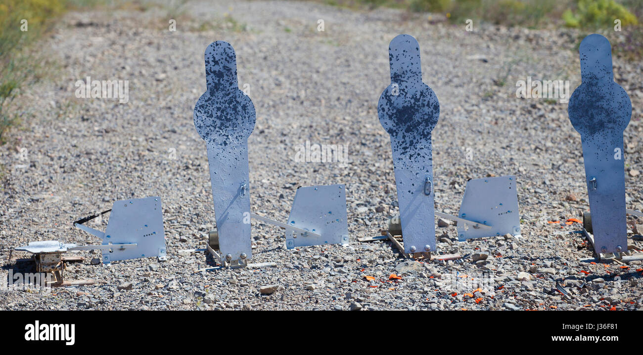 One of four steel shotgun targets that has been hit Stock Photo - Alamy