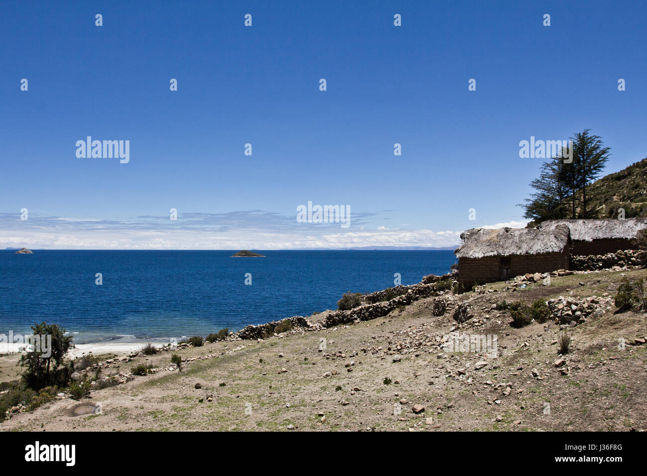 Landscape with hill and lake. Road and boat trip to Isla del Sol ...