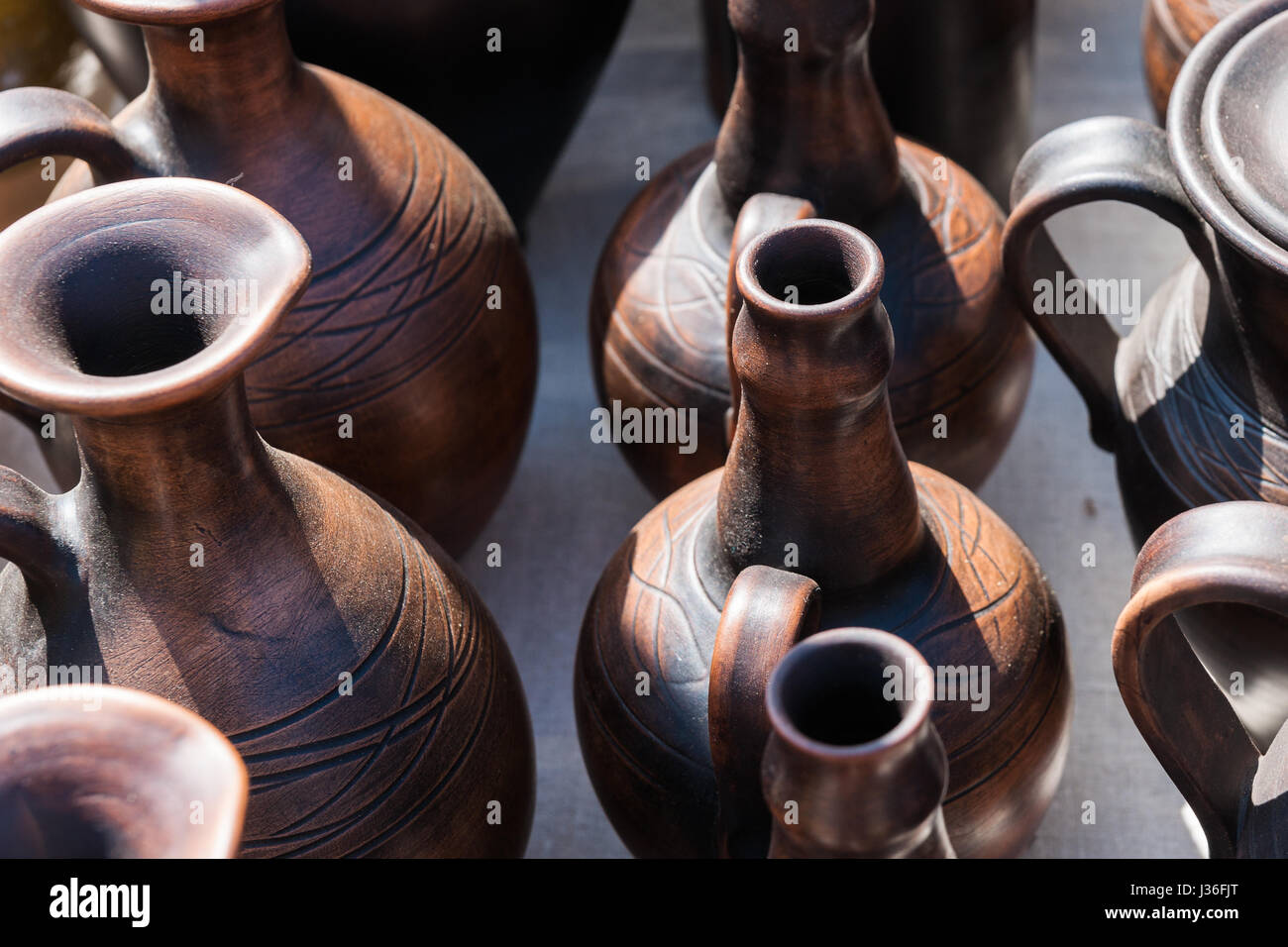 Pottery vessels of medieval style and of brown color on display for ...