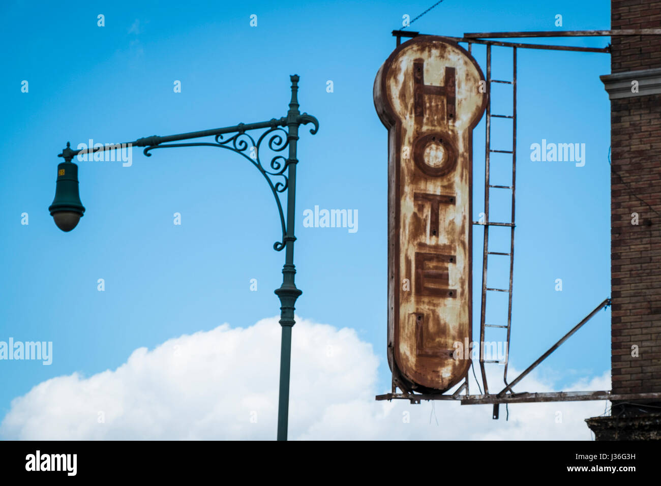 Old, decrepit, weathered sign for a hotel Stock Photo - Alamy