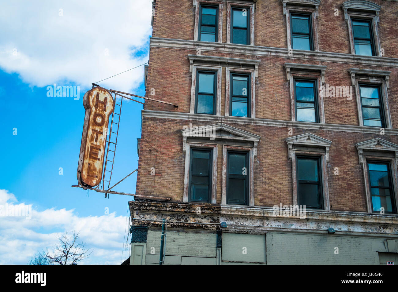 Old, decrepit, weathered sign for a hotel Stock Photo - Alamy
