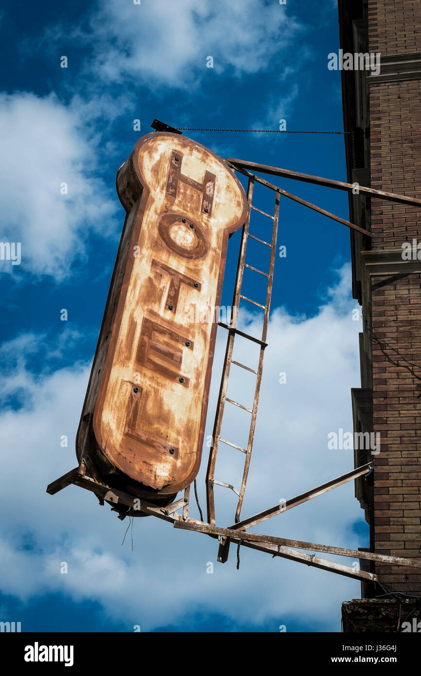 Old, decrepit, weathered sign for a hotel Stock Photo - Alamy