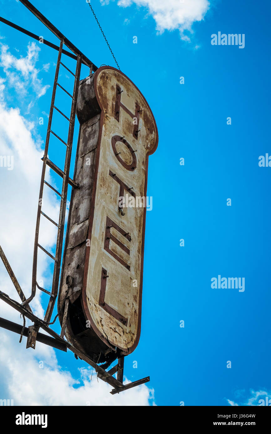 Old, decrepit, weathered sign for a hotel Stock Photo - Alamy