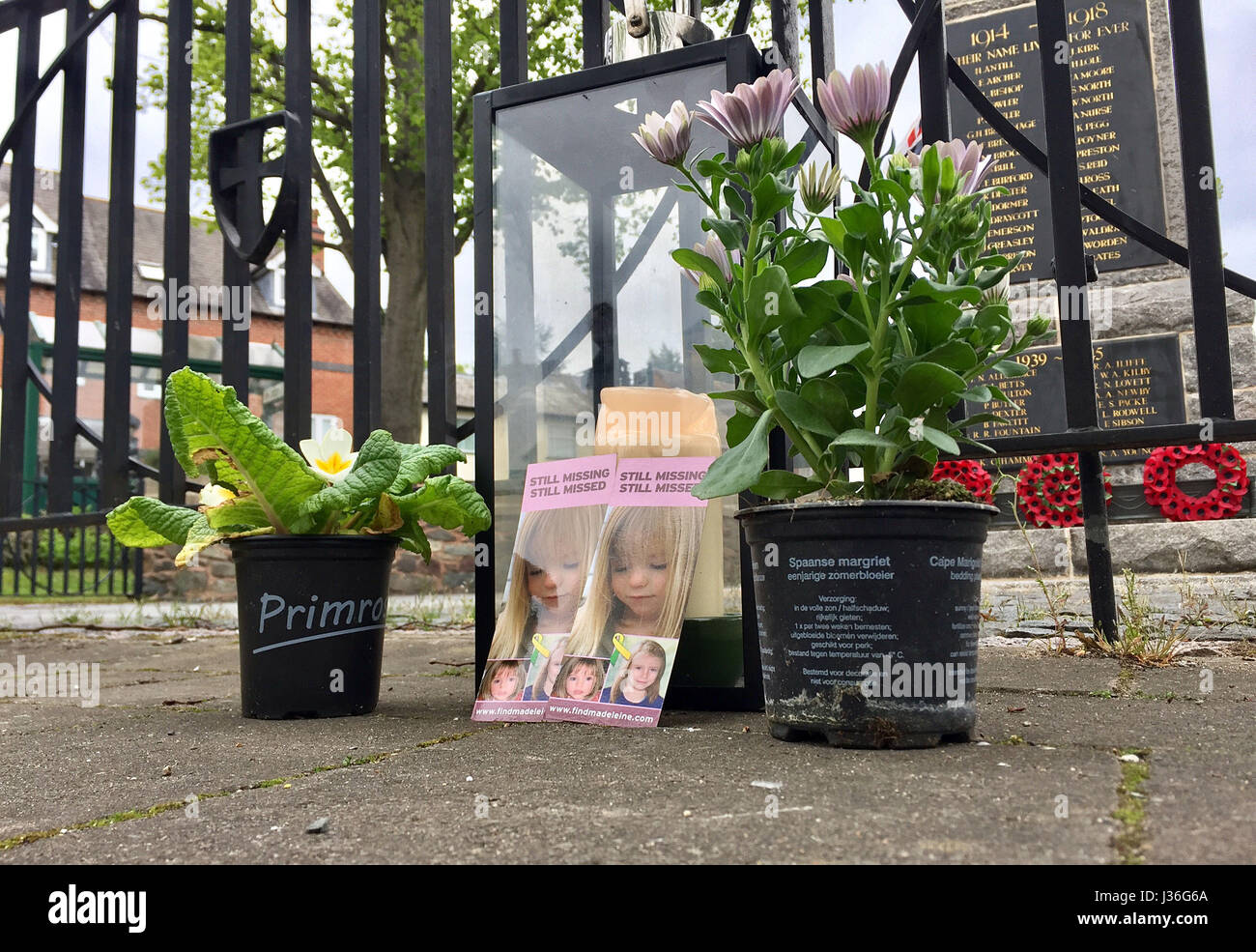 Tributes to Madeleine McCann next to the war memorial in Rothley, where ...