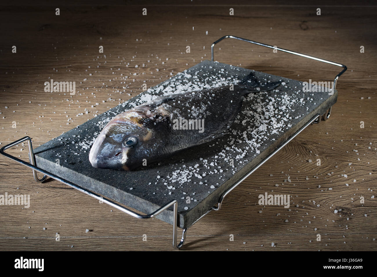 Orate on oil plate Stock Photo - Alamy