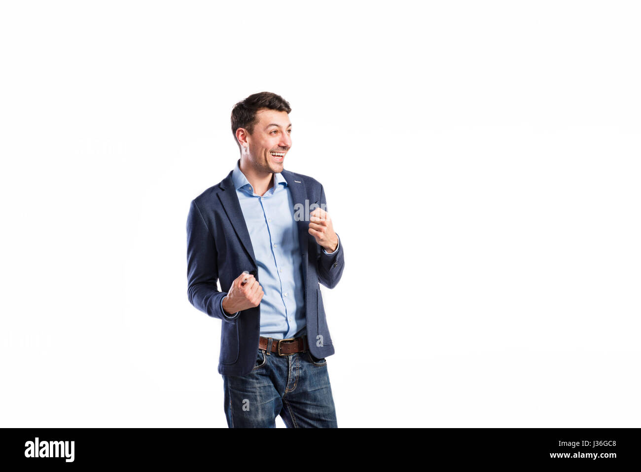 Handsome young man in blue jacket. Studio shot, isolated Stock Photo ...