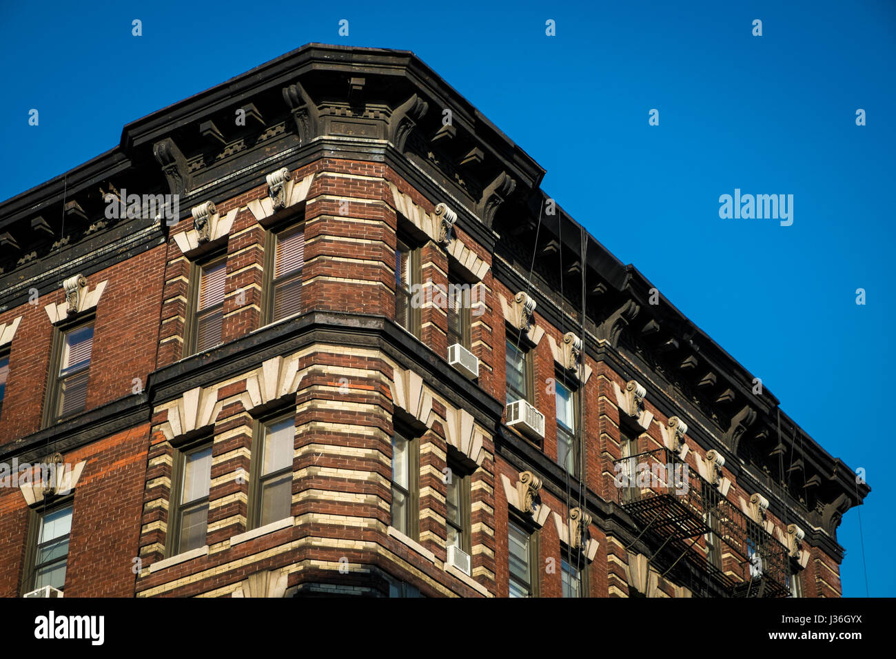 Classic old brown-brick apartment building in New York City Stock Photo ...