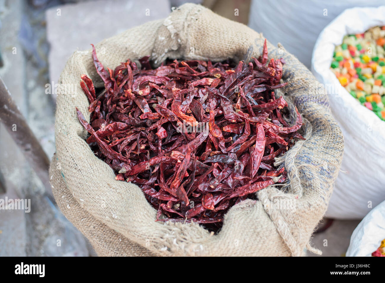 Dried Chilli in a sack at a food market in India Stock Photo - Alamy
