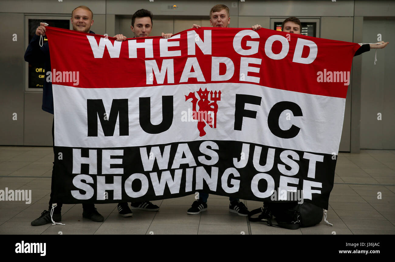 Manchester United fans show their support at Gatwick Airport on their ...