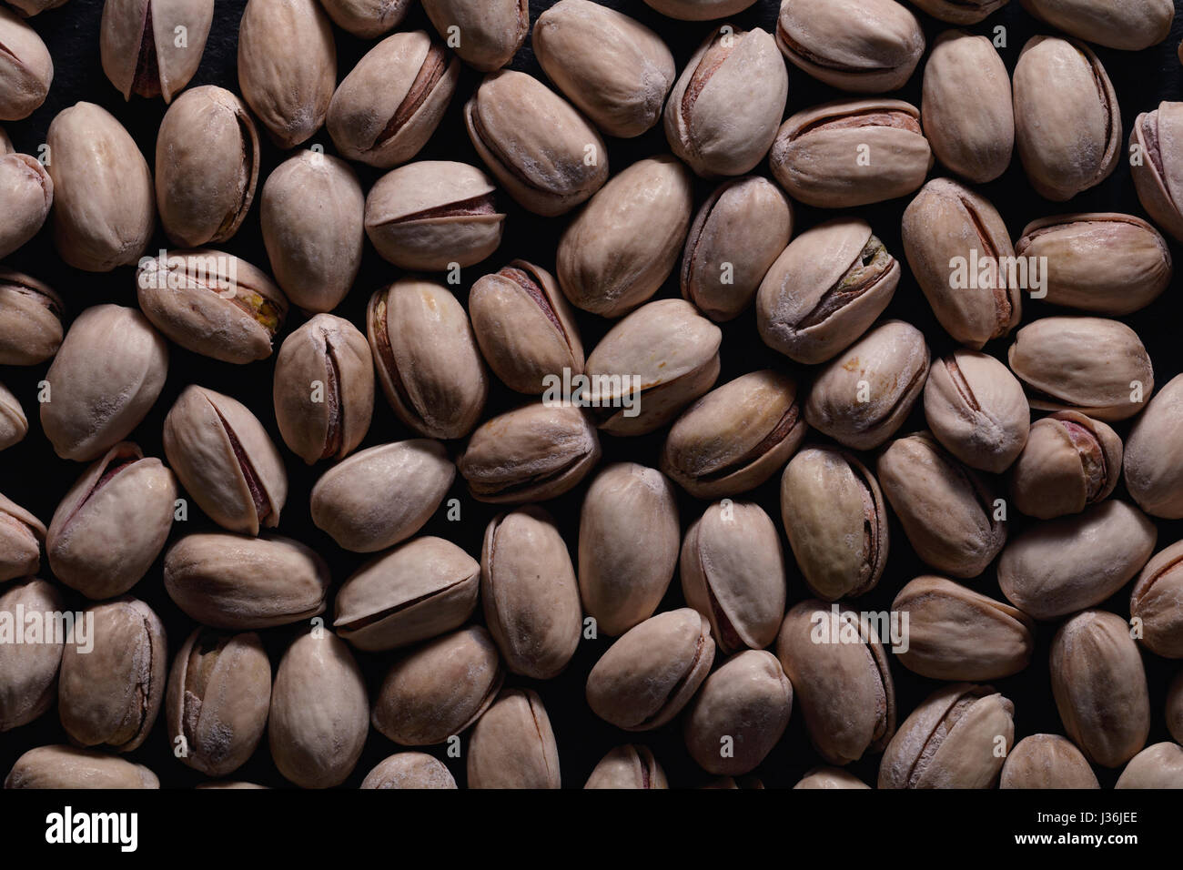 Full frame of roasted pistachios. Macro food photography. Top view ...