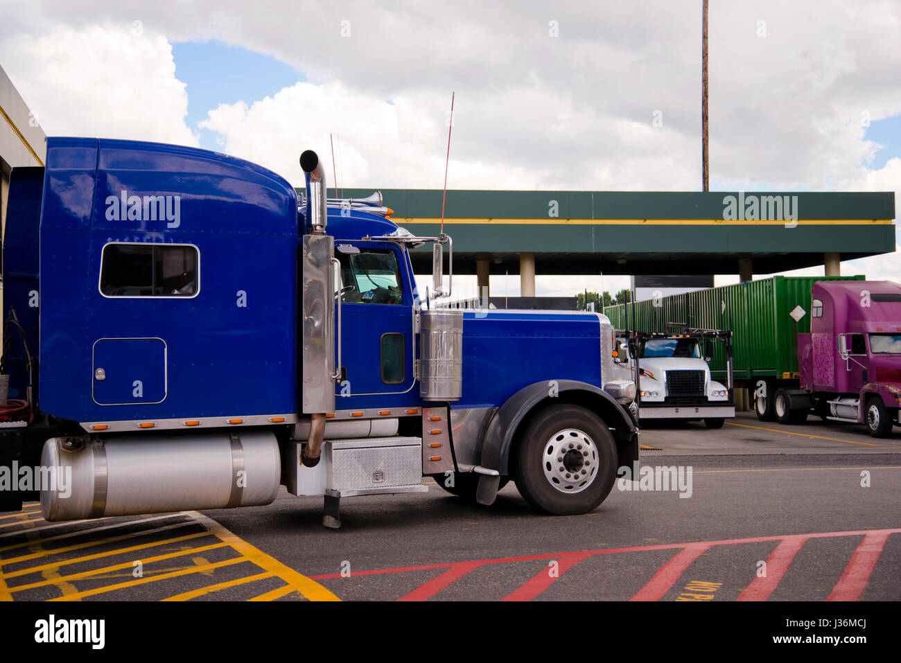 Blue classic American powerful heavy big rig semi truck with chrome ...