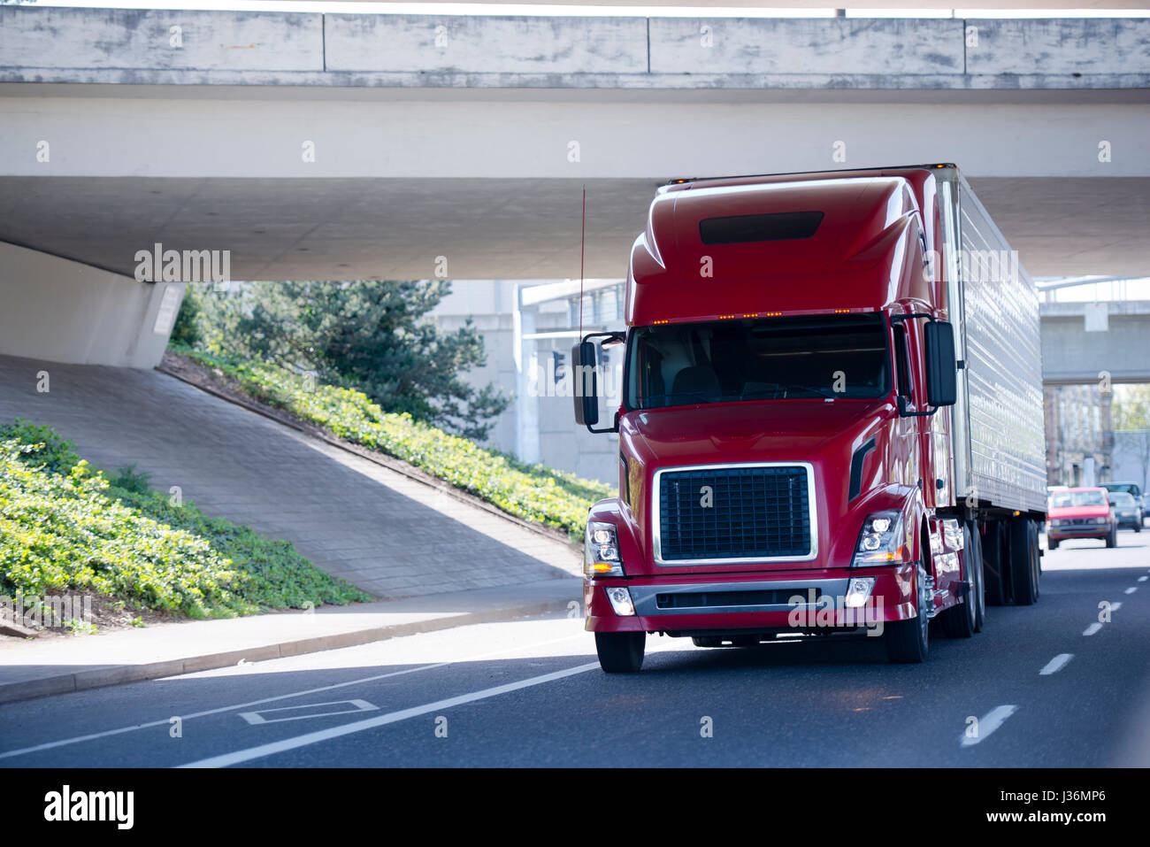 Red modern shiny big rig semi truck with refrigerated unit trailer ...
