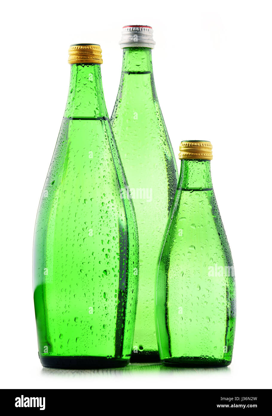 Glass bottles of mineral water isolated on white background Stock Photo - Alamy