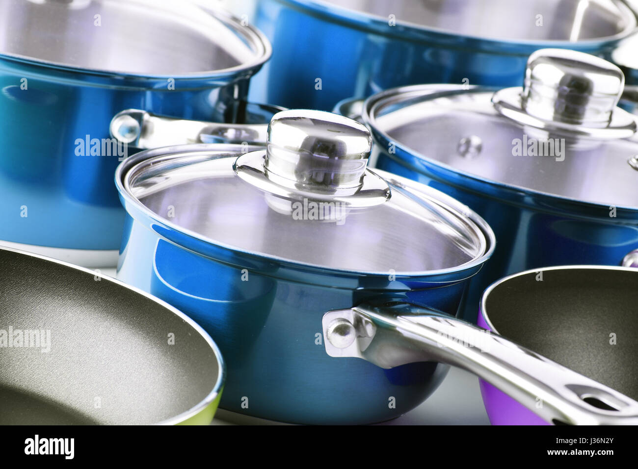 Composition with a set of steel pots Stock Photo - Alamy