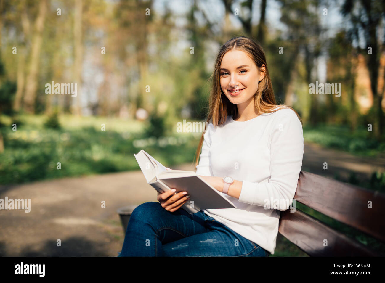 A shot of a college student reading a book Stock Photo - Alamy