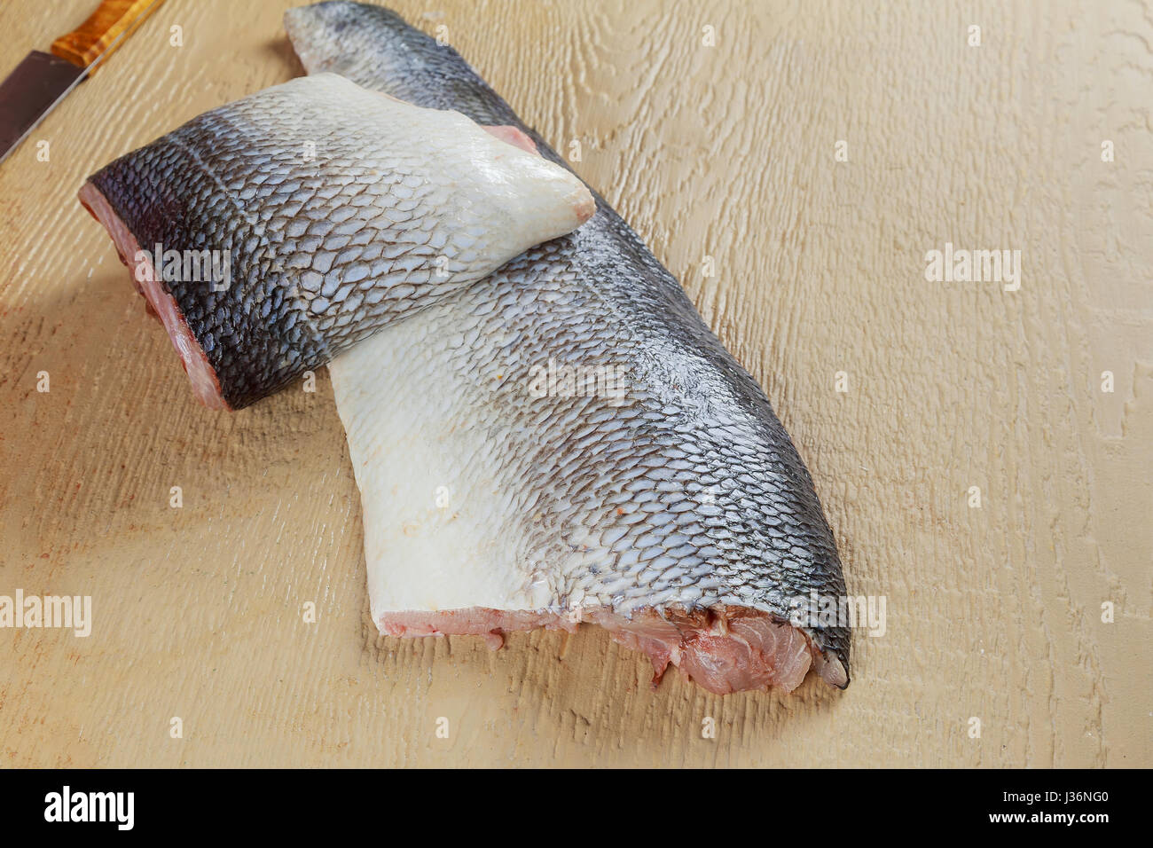 Top view of cleaning and filleting a fresh blyufish for cooking Stock ...
