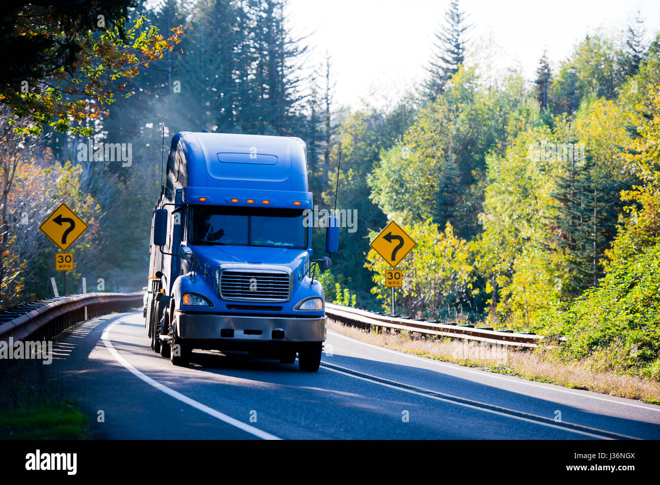 Semi truck driving through the mountains High Resolution Stock ...