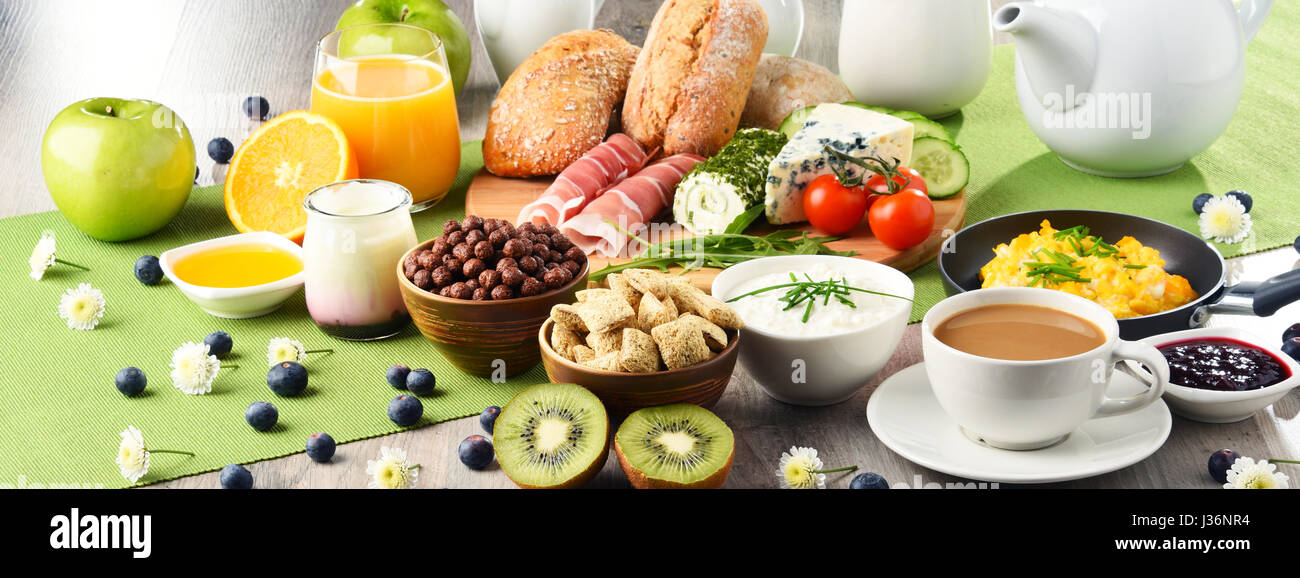 Breakfast served with coffee, orange juice, cheese, cereals and ...