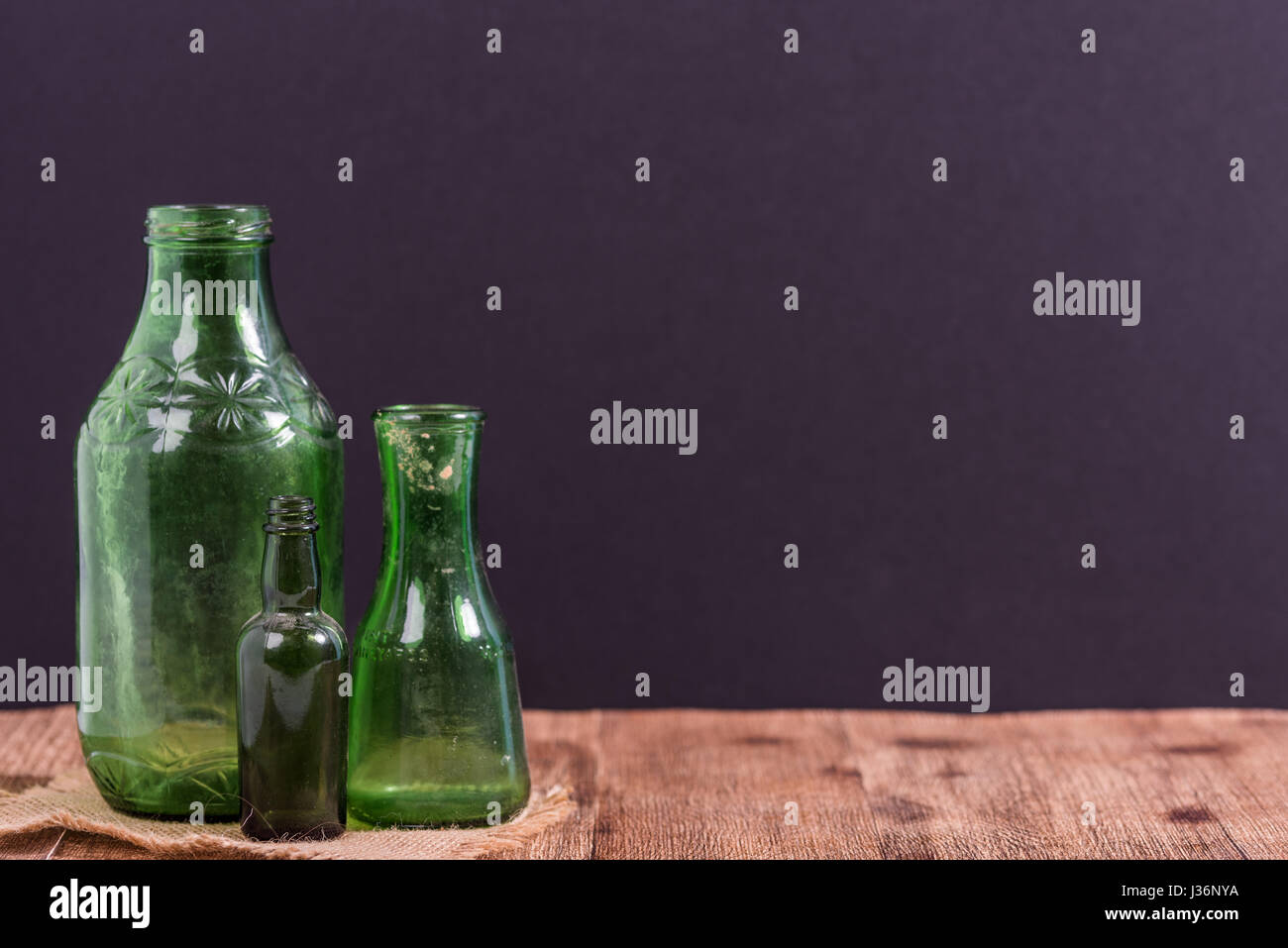 Vintage bottles in rustic setting Stock Photo - Alamy