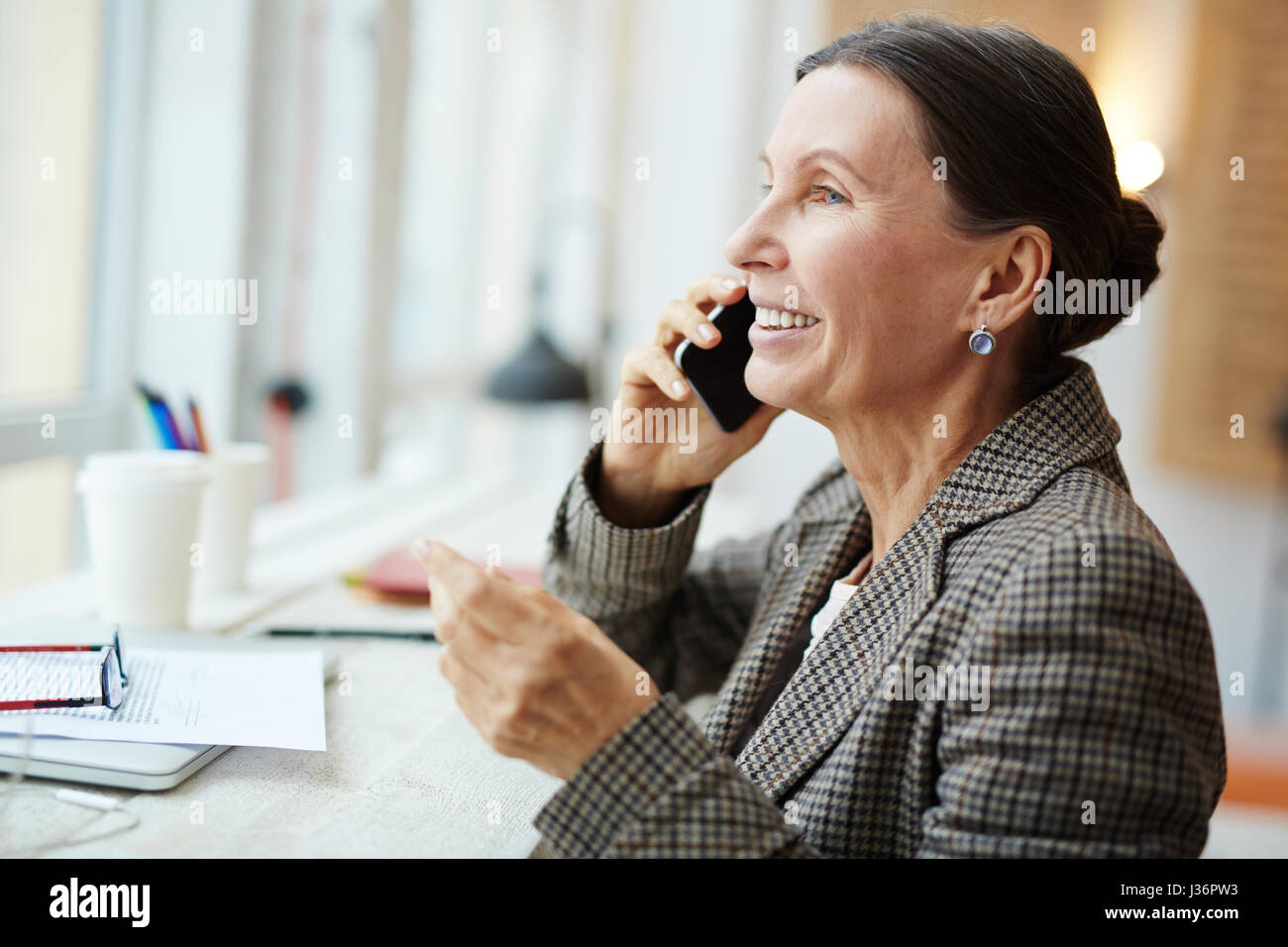 Pleasant senior woman talking hi-res stock photography and images - Alamy