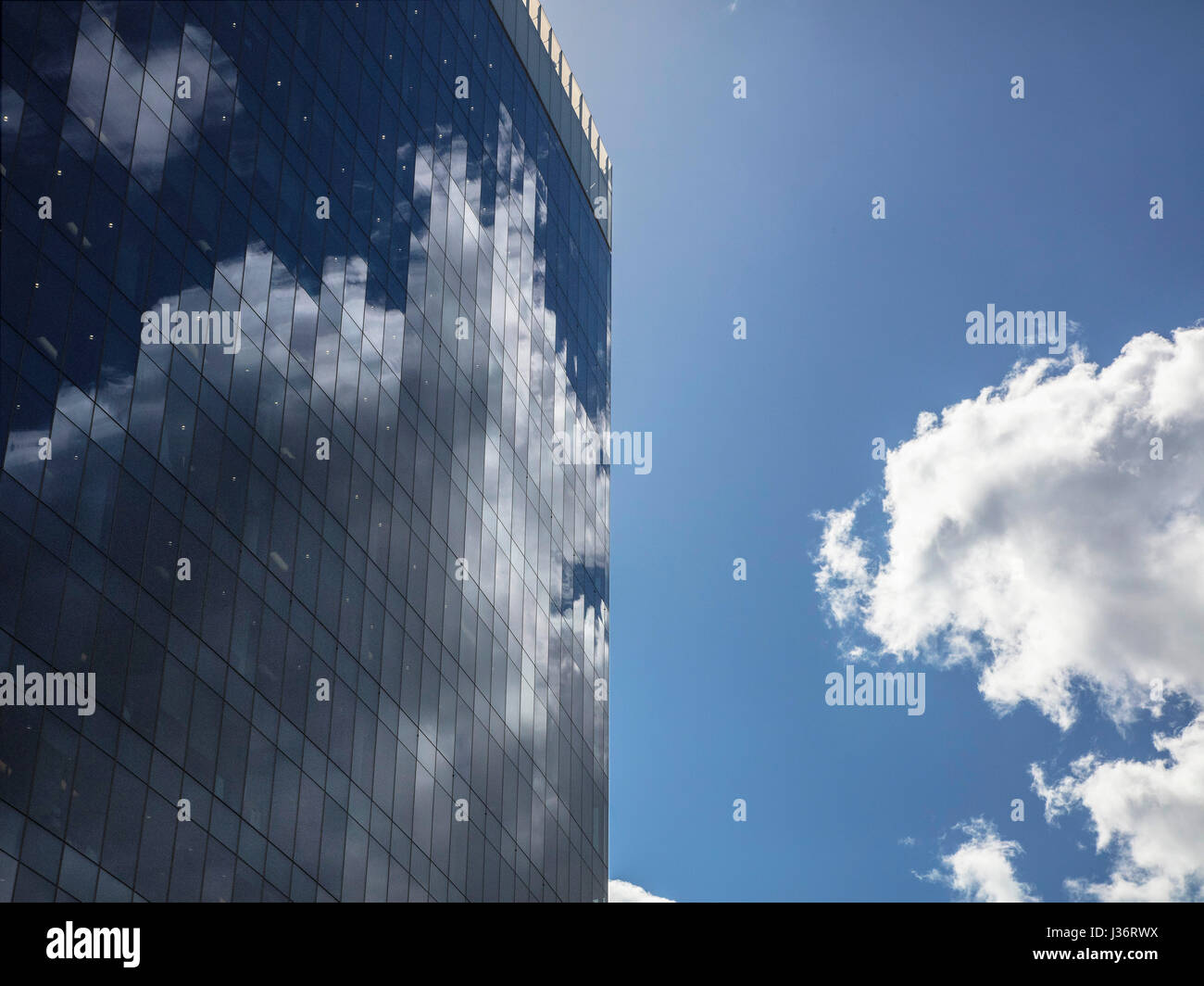 Cloud reflections on glass windows of modern high rise London office ...
