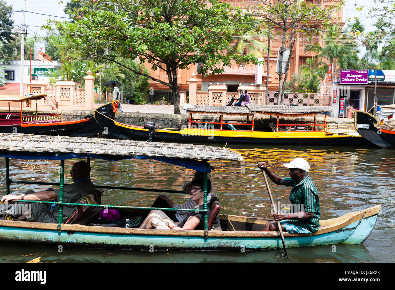 Tourists take a private boat watching the world go by Alleppey Stock ...