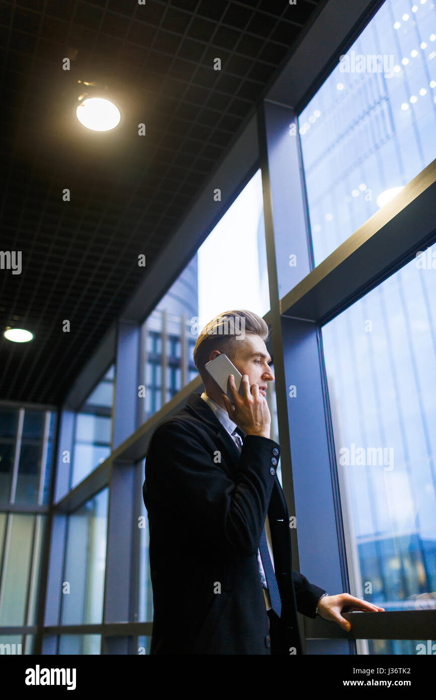 Phone Conversation in Office Lobby Stock Photo - Alamy