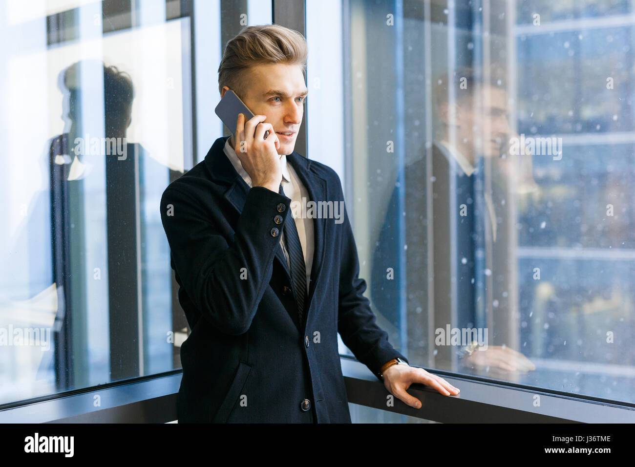 Handsome businessman talking hi-res stock photography and images - Alamy