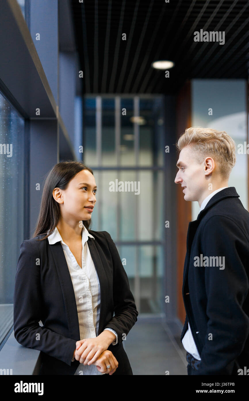 Young businesspeople discussing work hi-res stock photography and ...