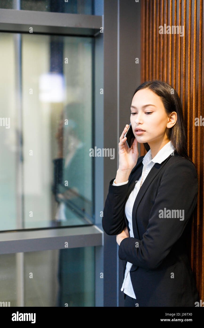 Attractive Businesswoman Answering on Phone Call Stock Photo - Alamy