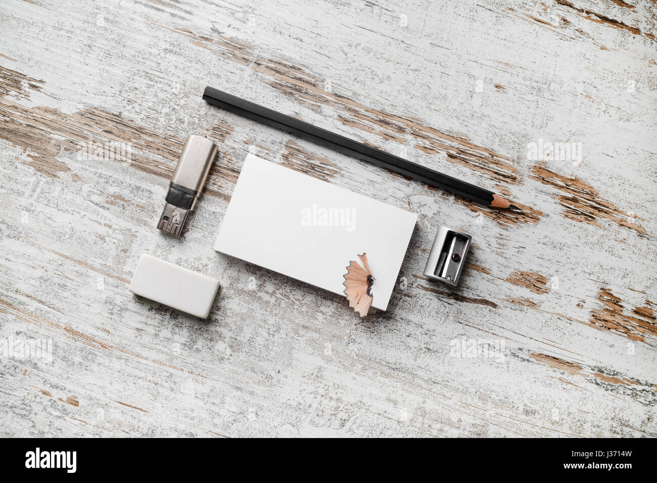 Photo of blank business cards, pencil, eraser, flash drive and ...