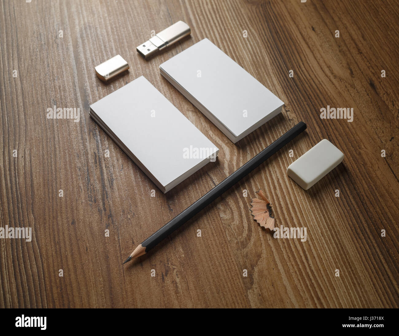 Bank business cards, pencil, eraser and flash drive. Blank paperwork ...