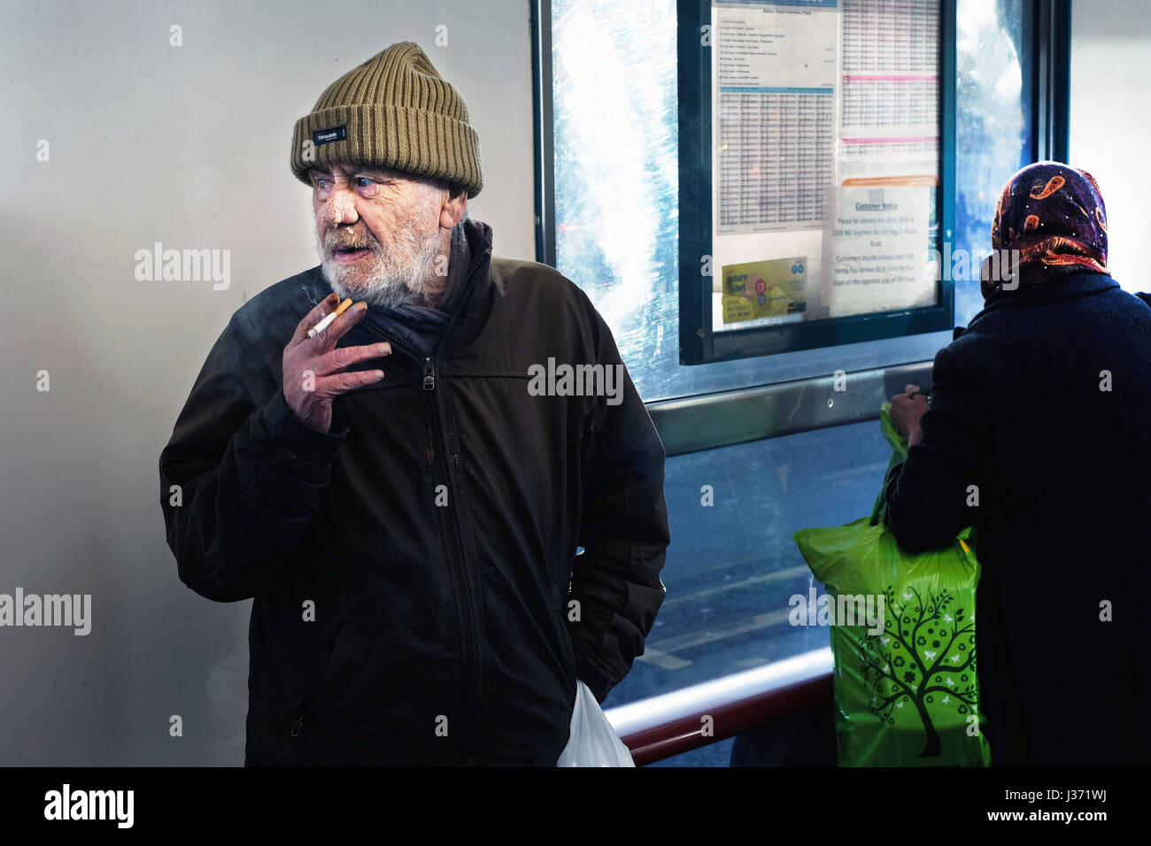 smoking at the bus stop in Cardiff, Wales, UK Stock Photo - Alamy