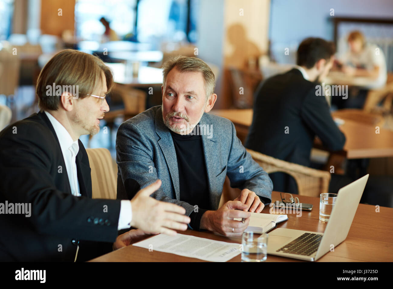 Discussing Business Terms and Conditions Stock Photo - Alamy