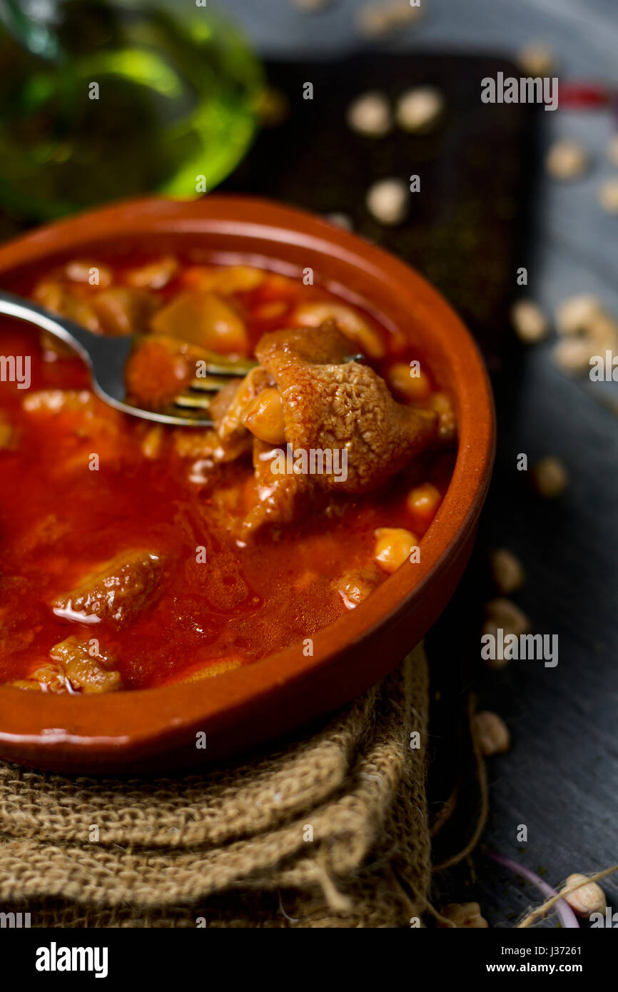 closeup of an earthenware bowl with spanish callos, a typical stew with ...