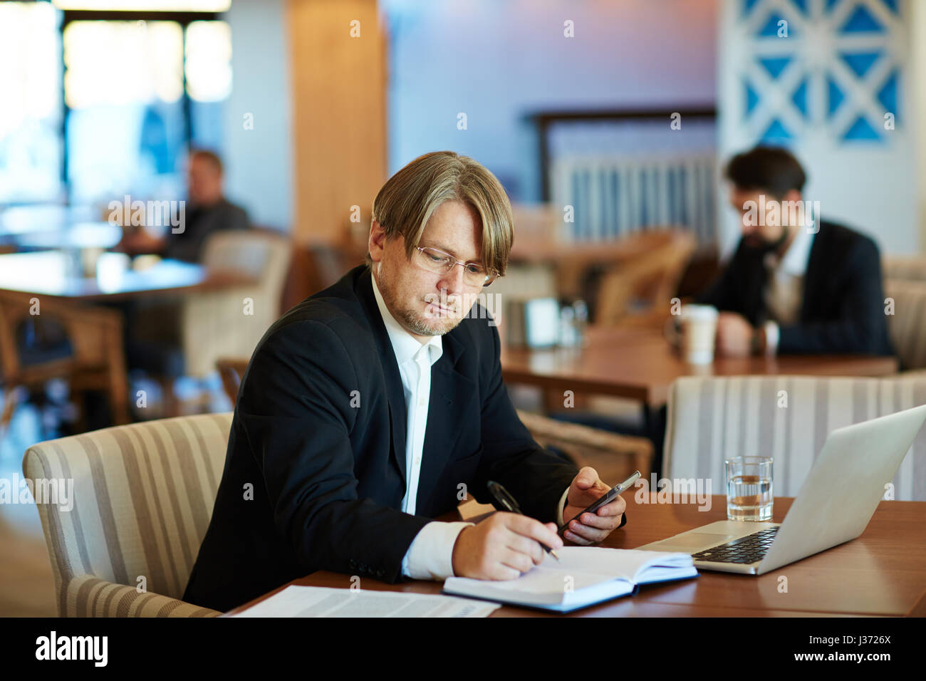 Taking Notes in Restaurant Stock Photo - Alamy