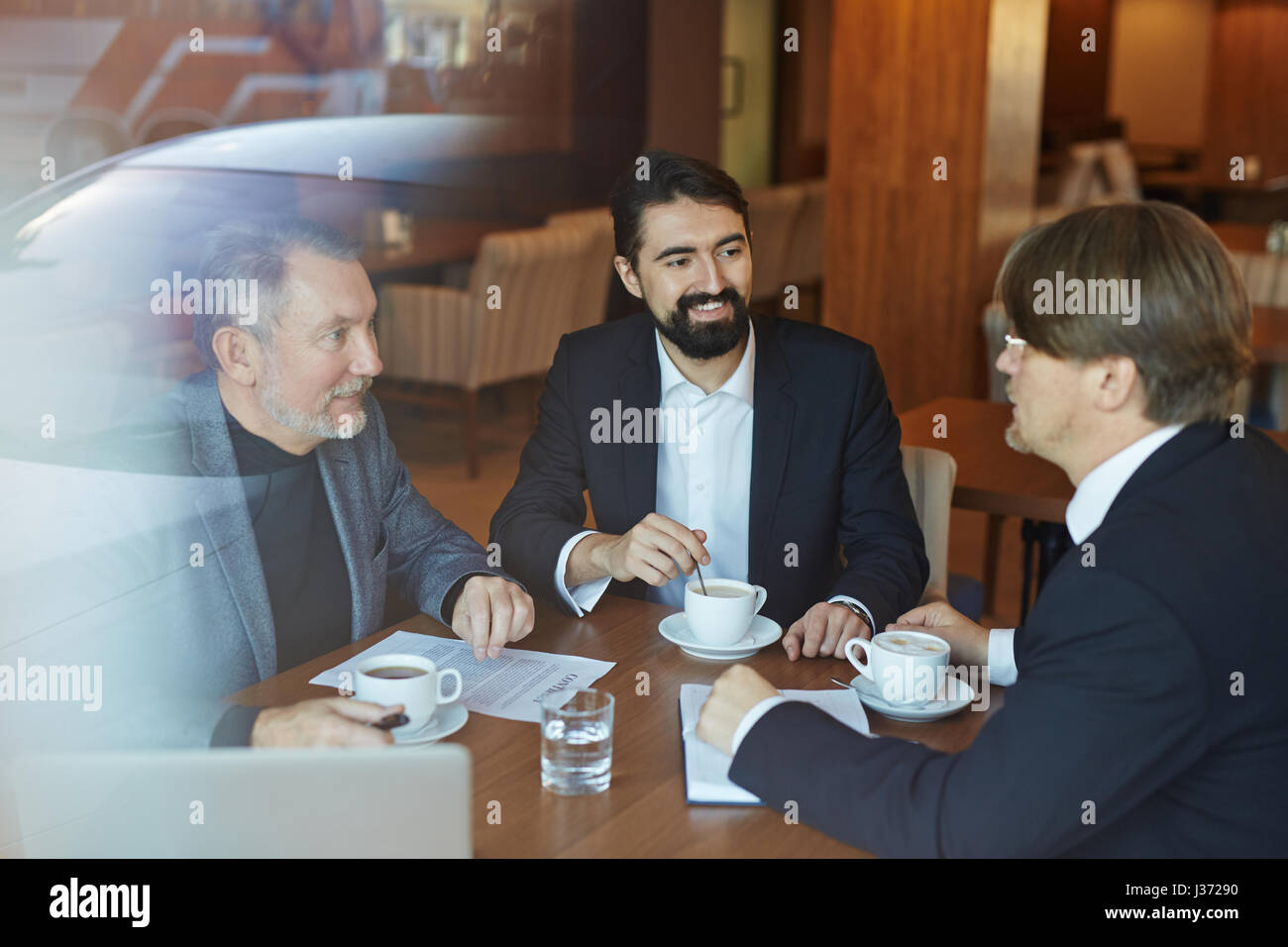 Project Discussion during Coffee Break Stock Photo - Alamy