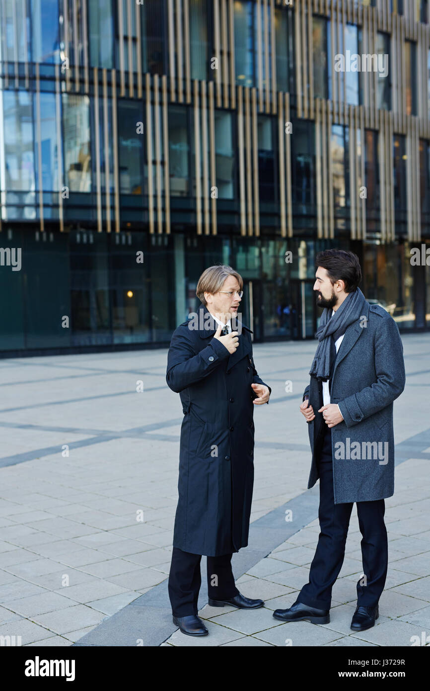 Discussing Joint Project with Colleague Stock Photo - Alamy
