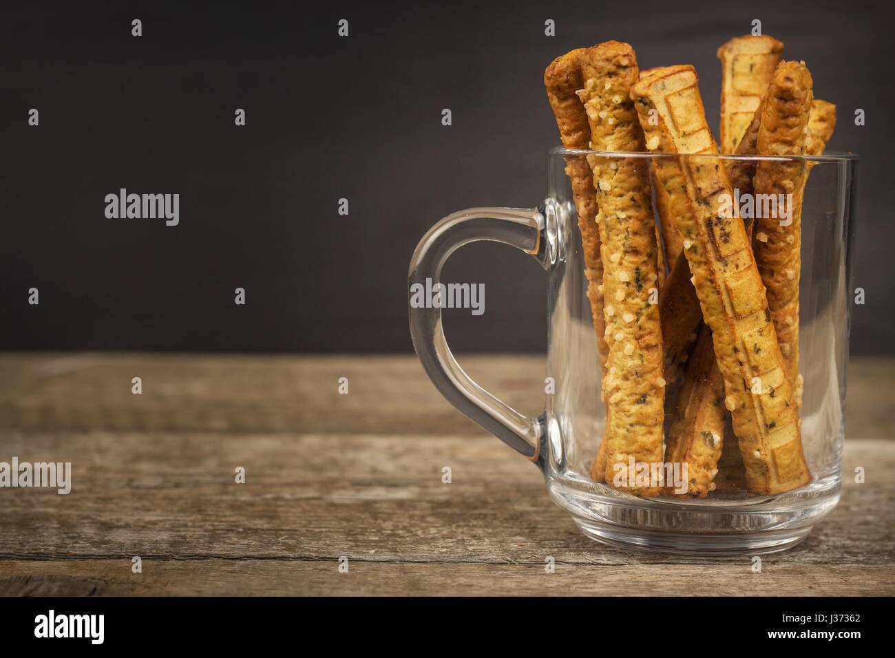 Salt sticks in a glass. Snack party. Unhealthy pastry for beer Stock ...