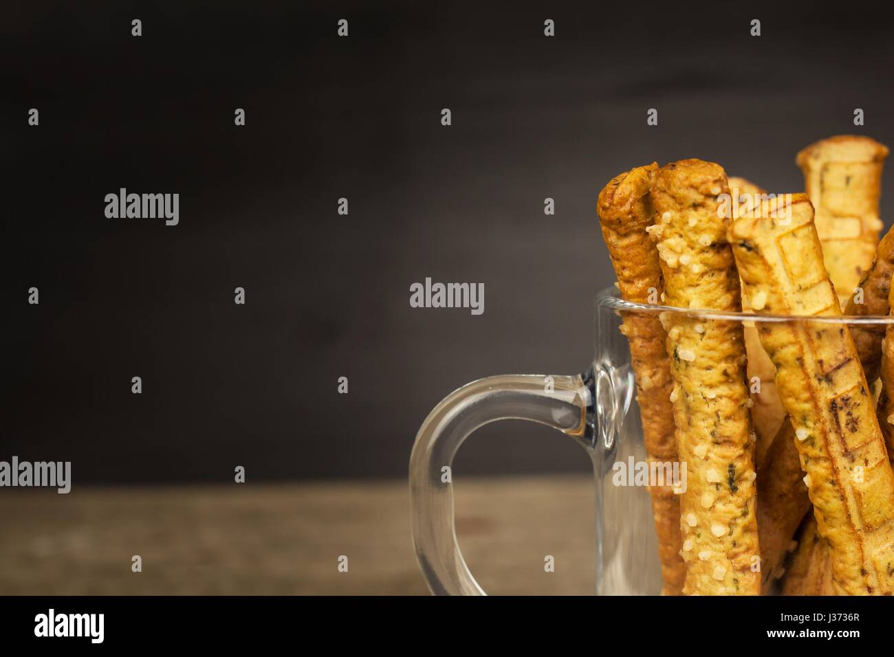 Salt sticks in a glass. Snack party. Unhealthy pastry for beer Stock ...