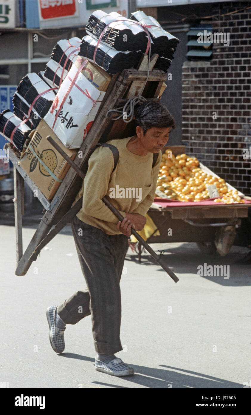 Porter carrying heavy load, Seoul City, South Korea, Asia Stock Photo ...