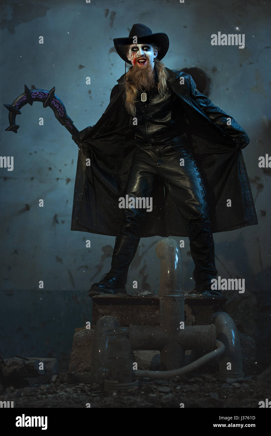 Man causing horror on his face a sinister smile Stock Photo - Alamy