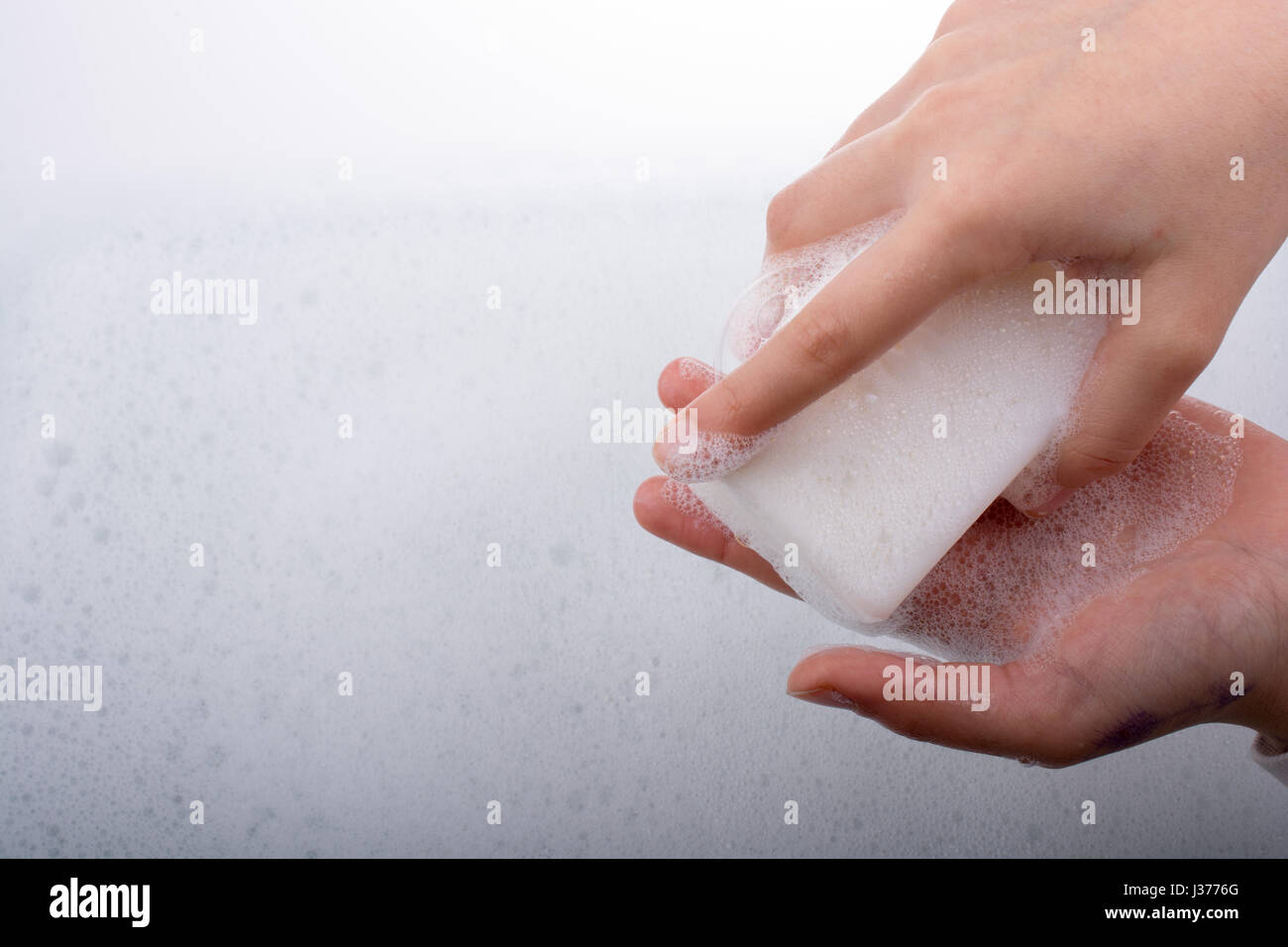 Hand washing and soap foam on a foamy background Stock Photo - Alamy