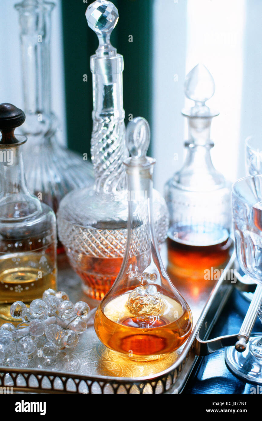 Assorted range of antique bottles with alcohol Stock Photo - Alamy